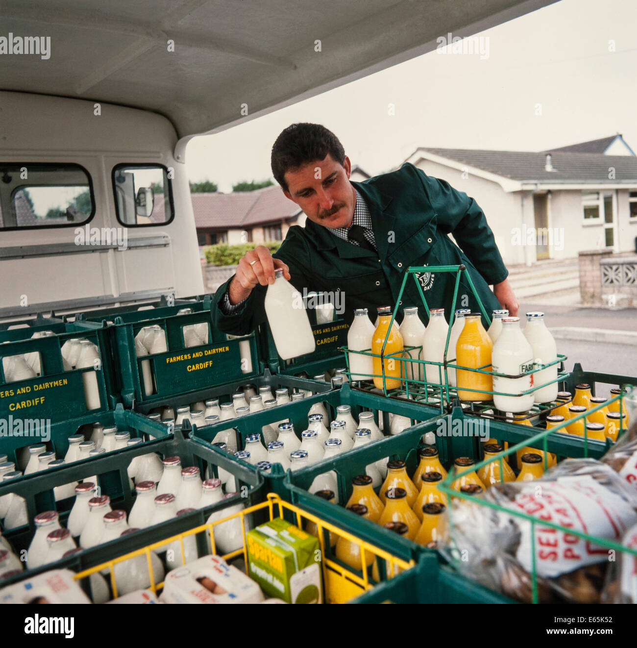 Milkman on his round Stock Photo - Alamy