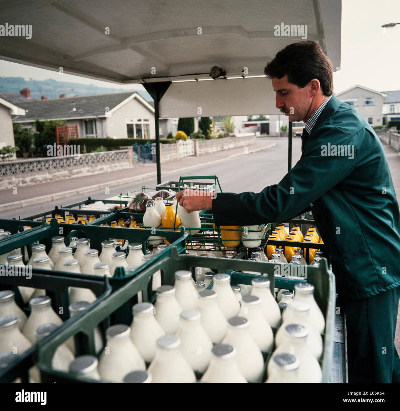 Milkman on his round Stock Photo - Alamy