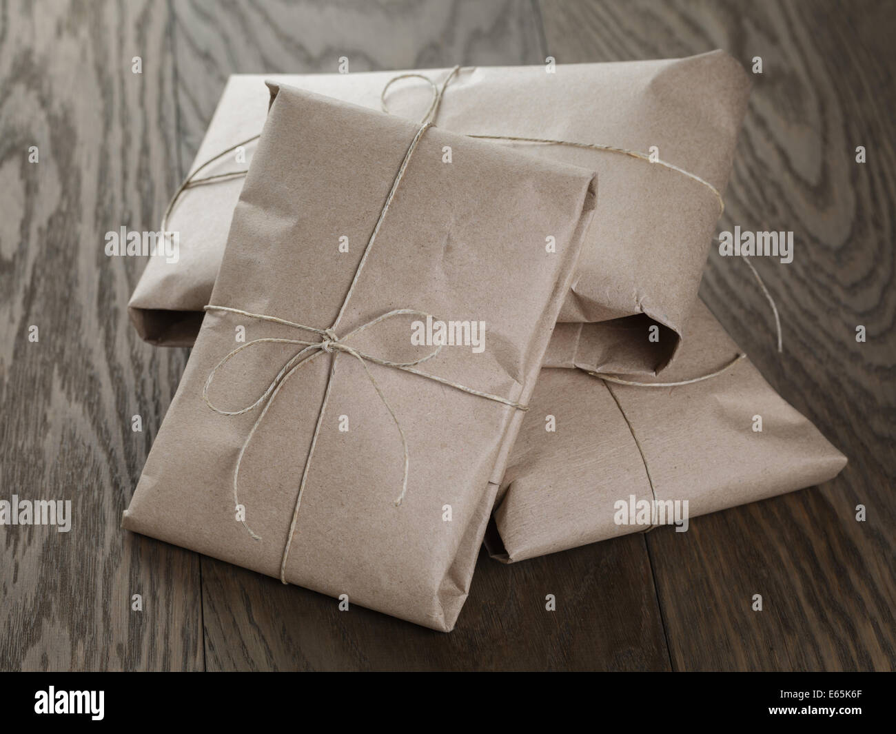 vintage style parcels on wood table, rustic photo Stock Photo - Alamy