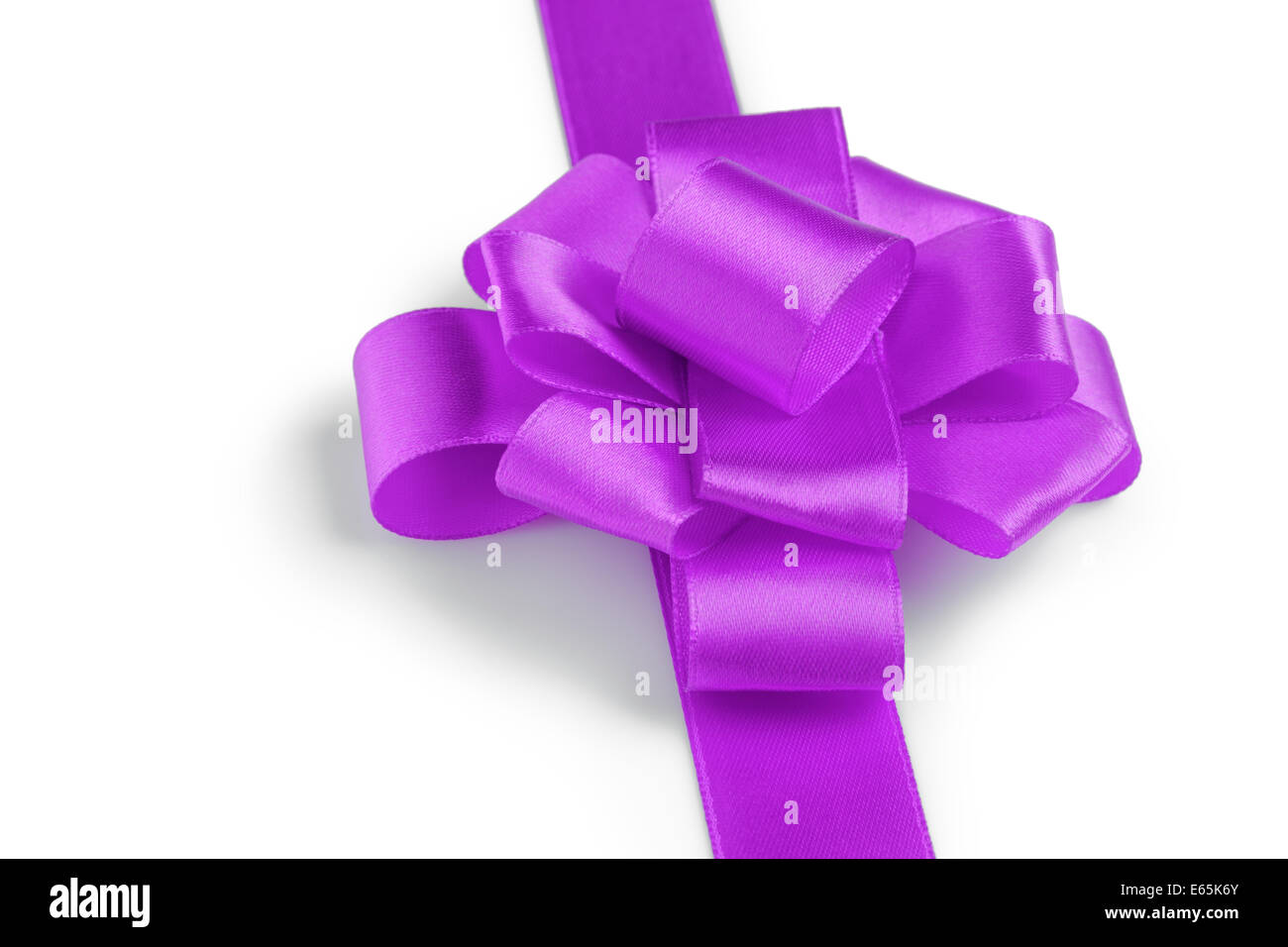 purple ribbon bow angle photo, white background Stock Photo - Alamy