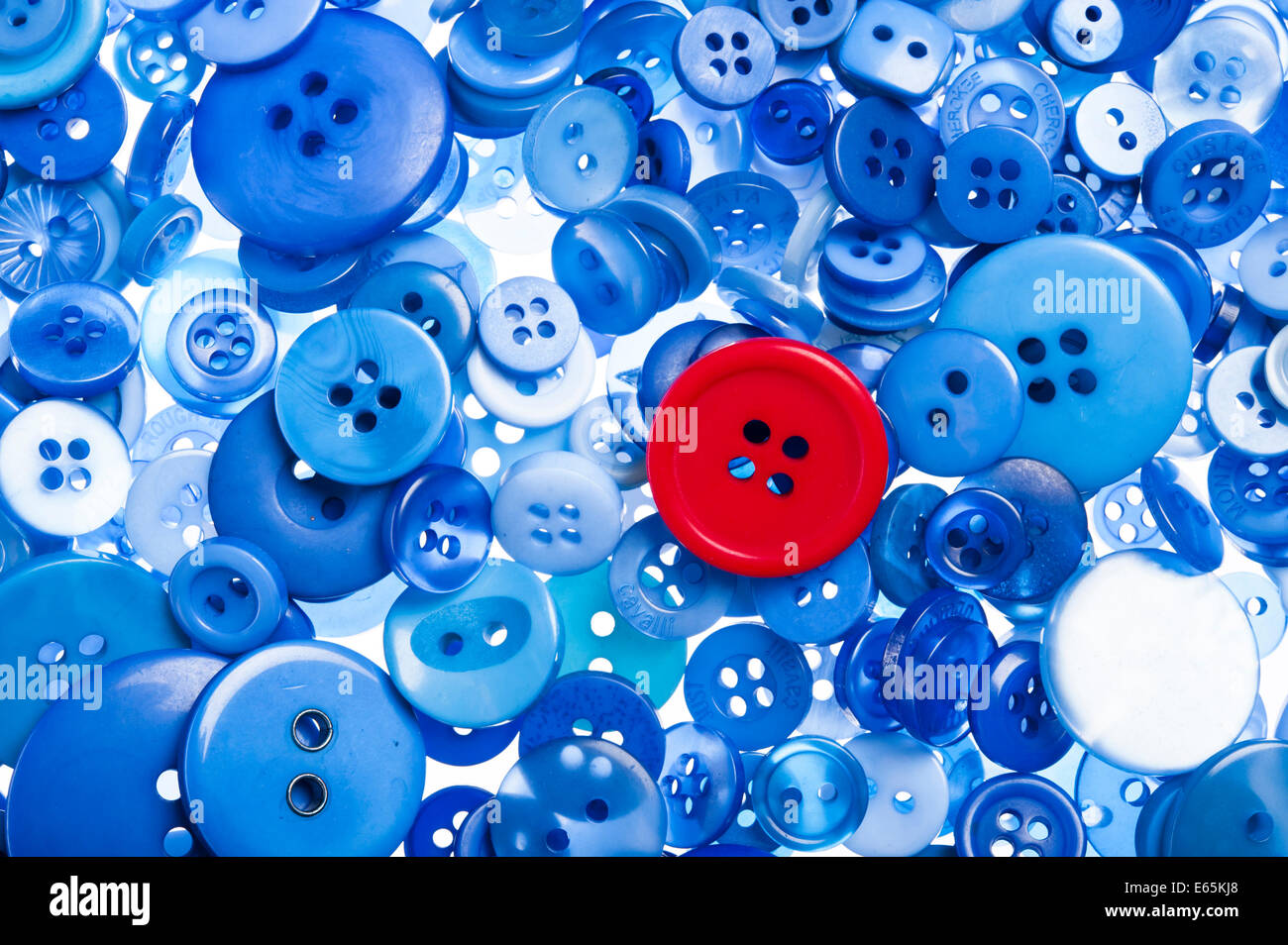 blue buttons and one red Stock Photo - Alamy