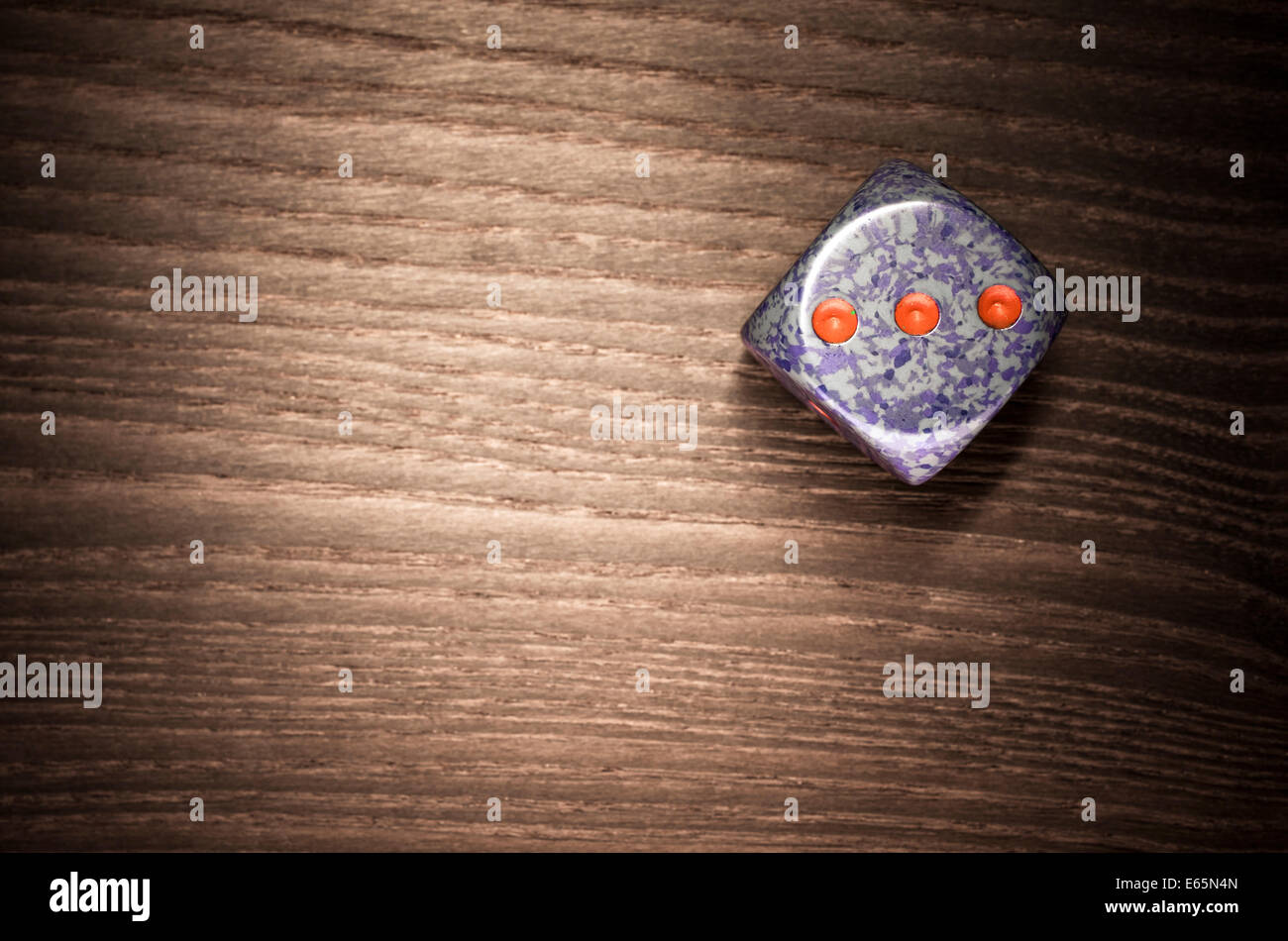 dice on a wood surface Stock Photo - Alamy