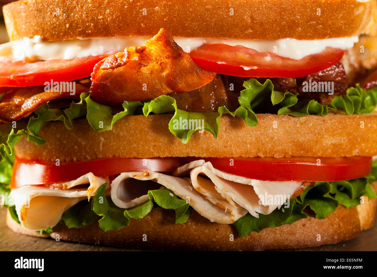 Turkey and Bacon Club Sandwich with Lettuce and Tomato Stock Photo - Alamy