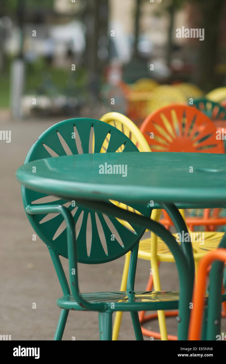 Multi-color table and chairs in a circle shape form Stock Photo - Alamy