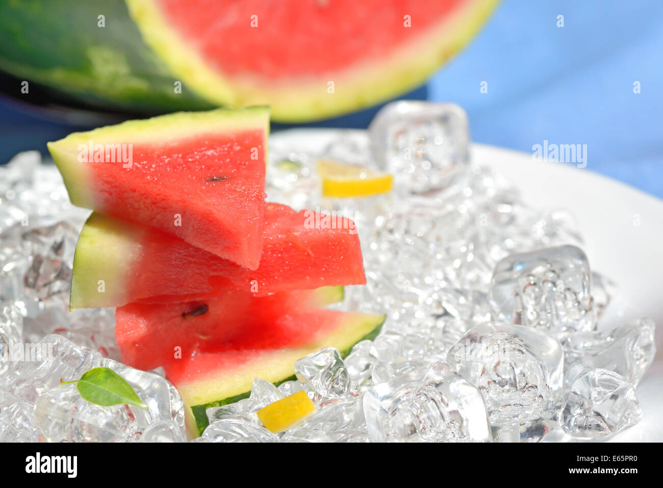 slices of red watermelon and ice cubes Stock Photo - Alamy