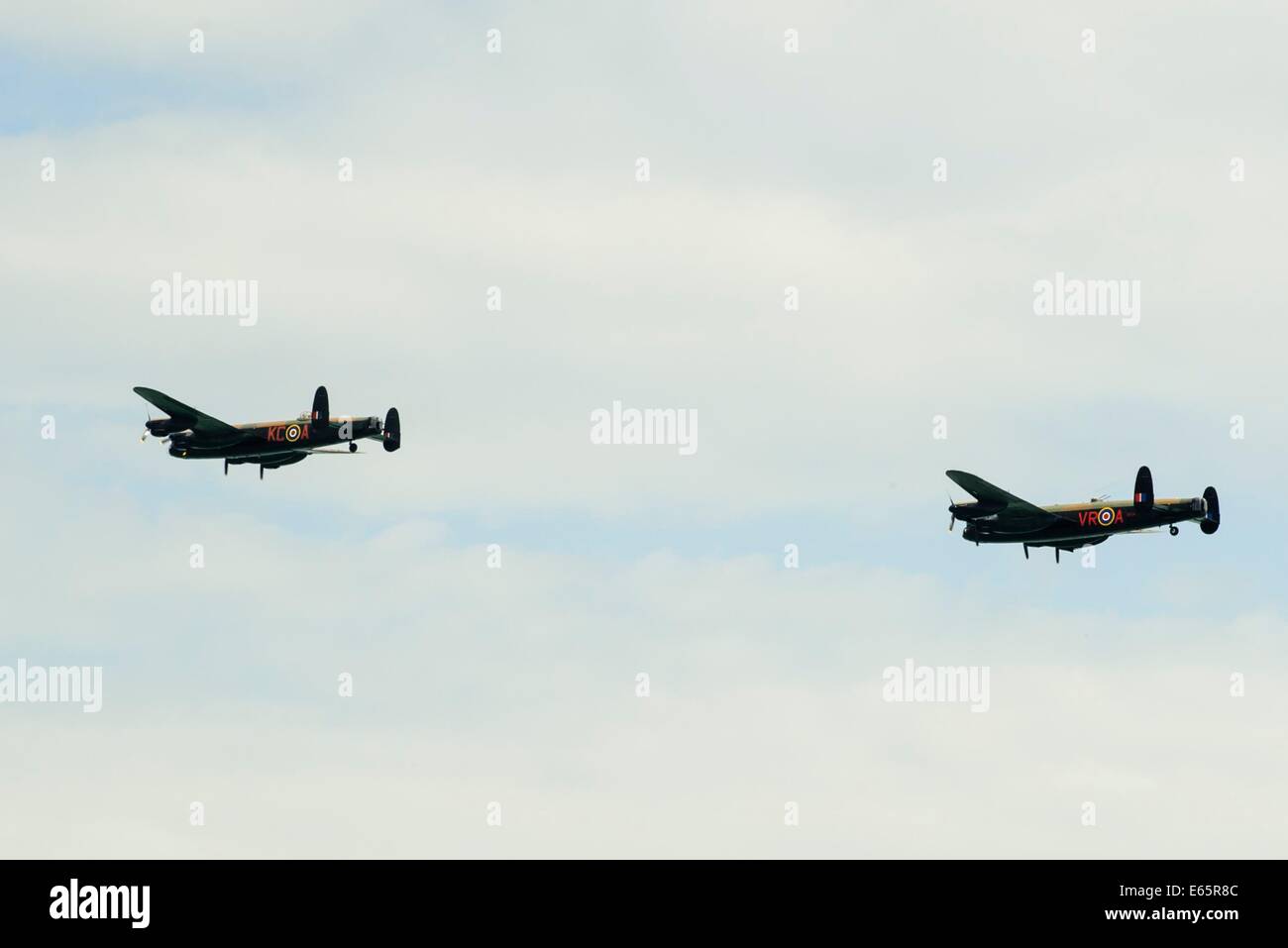 Lancaster bomber and a spitfire fly over eastbourne hi-res stock ...