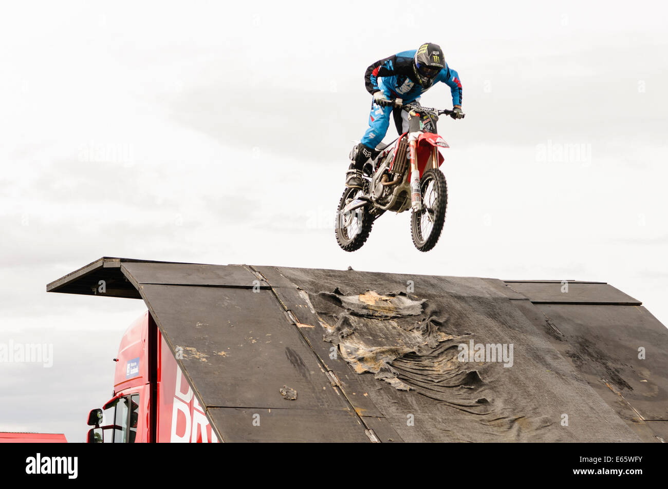 A motorcyclist makes a massive stunt jump Stock Photo - Alamy