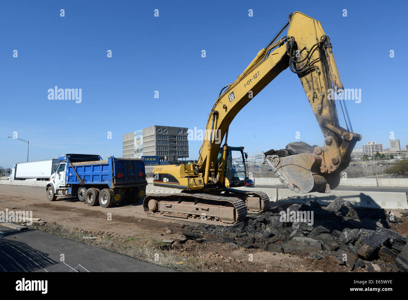 Working excavator road construction hi-res stock photography and images ...