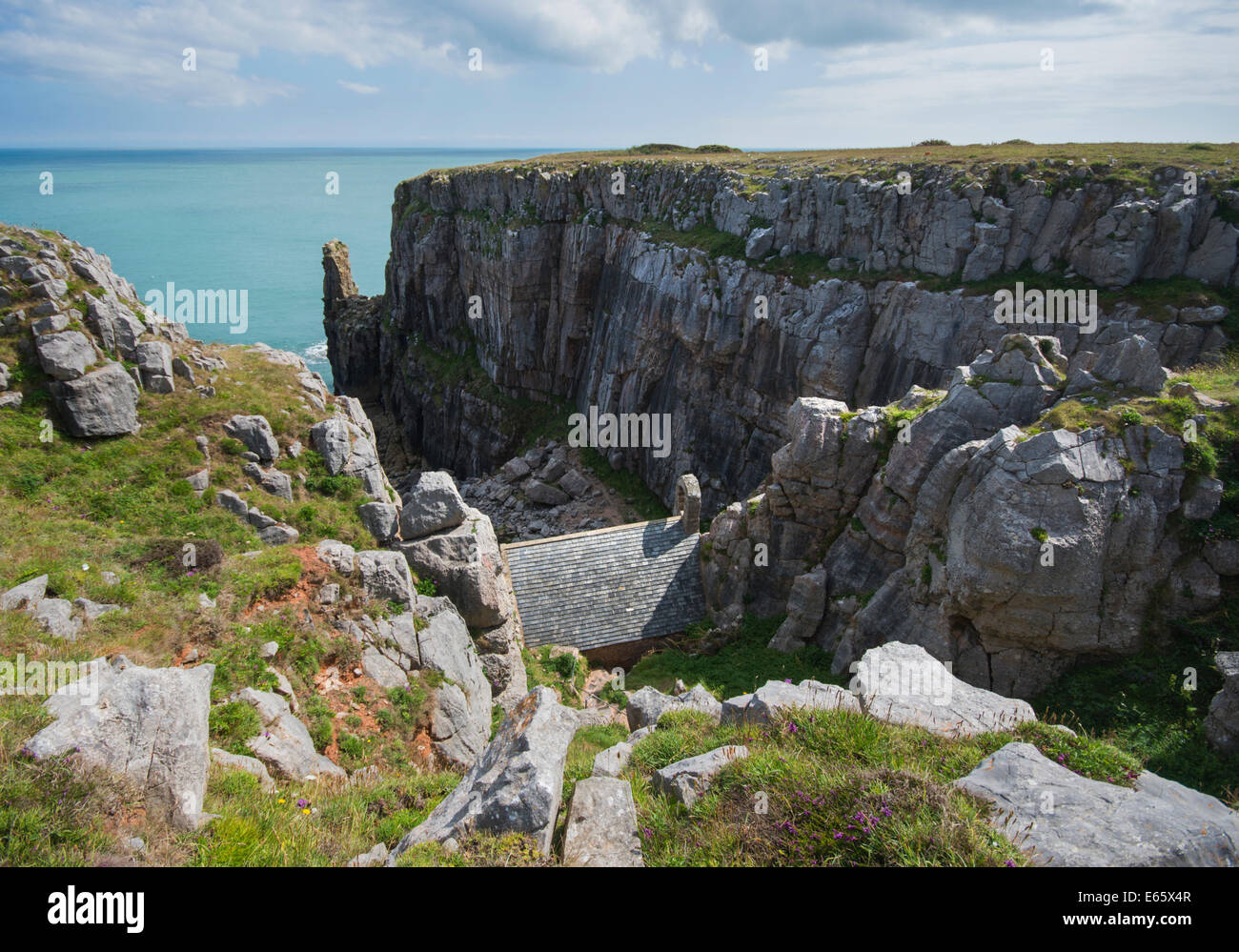 St Govan's Chapel nestled into the cliffs at St Govan's Head on the ...