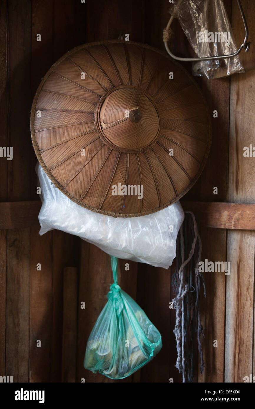 A traditional hat worn by many people in Myanmar (Burma). The green bag ...
