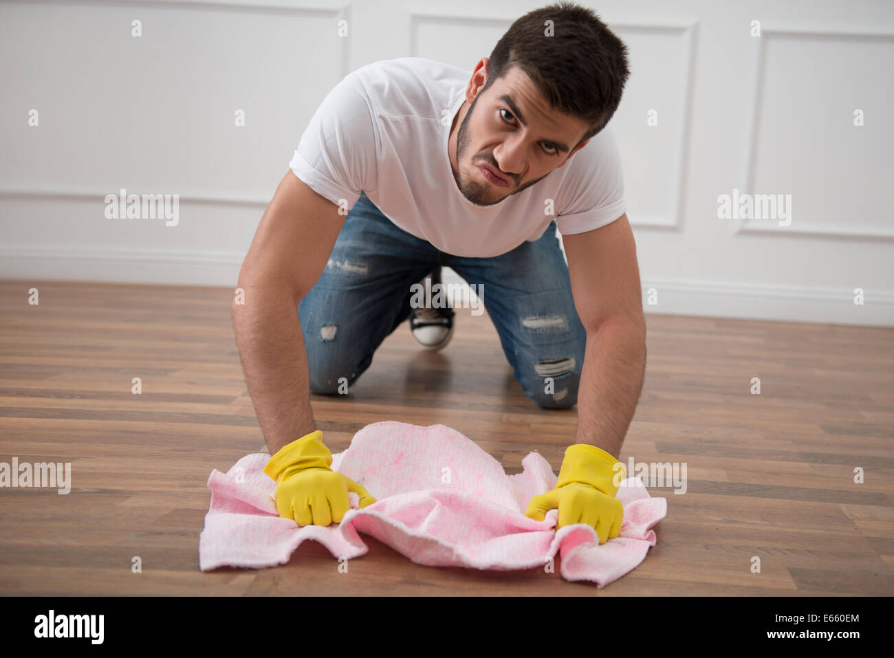 Male janitor sweeping floor hi-res stock photography and images - Alamy