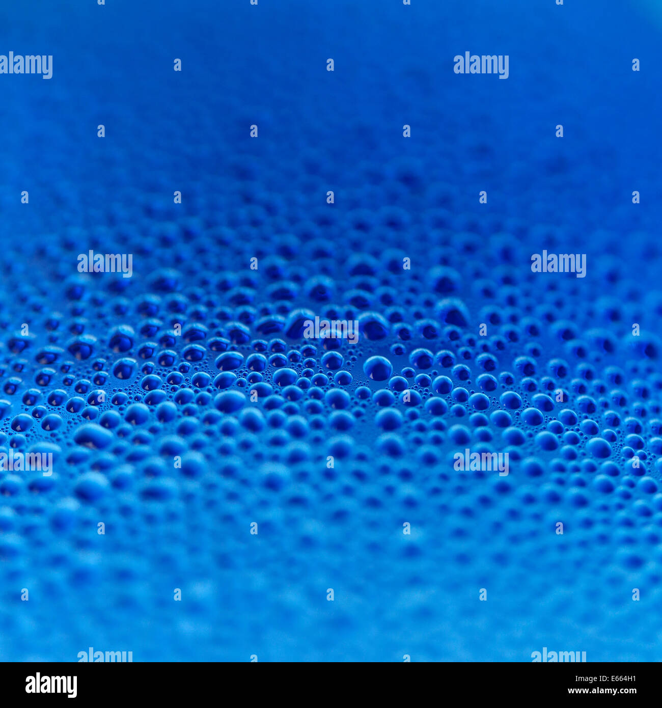 Water drops on blue bottle background Stock Photo - Alamy