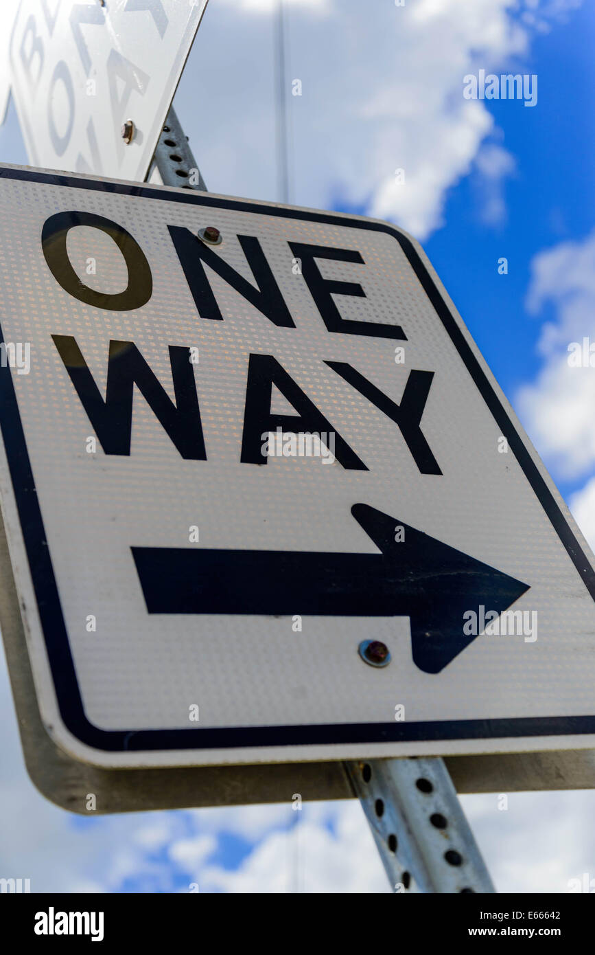 Blue one way sign hi-res stock photography and images - Alamy