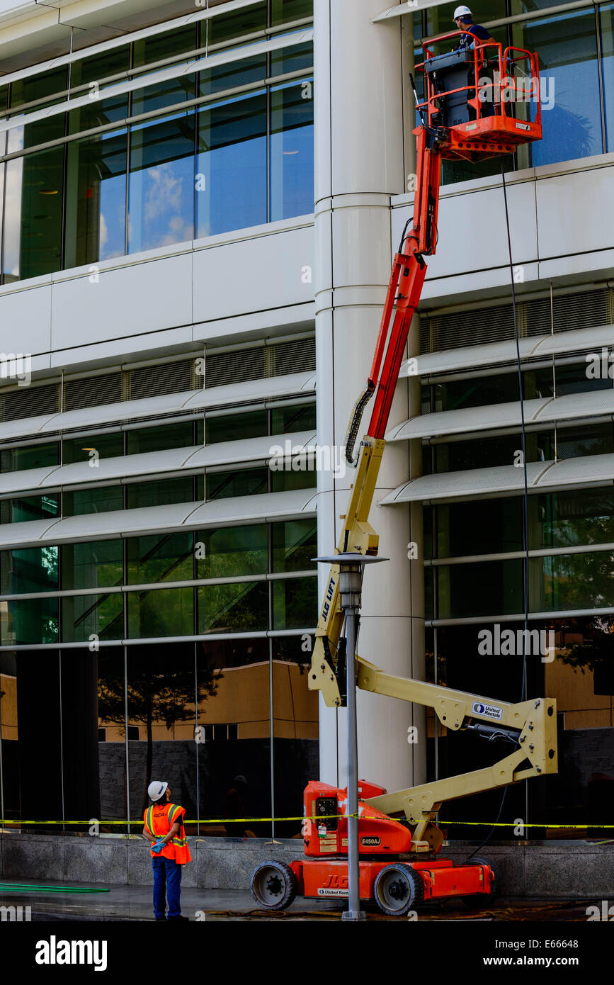 window washing crew on a lift Stock Photo - Alamy