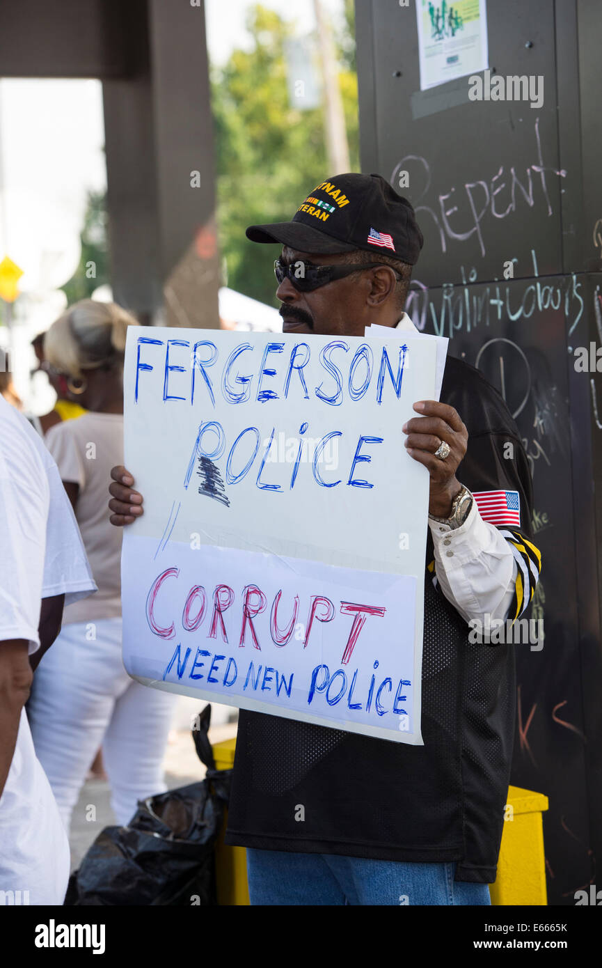 Ferguson, MO, USA. August 15, 2014. Demonstrator holds sign at the site ...