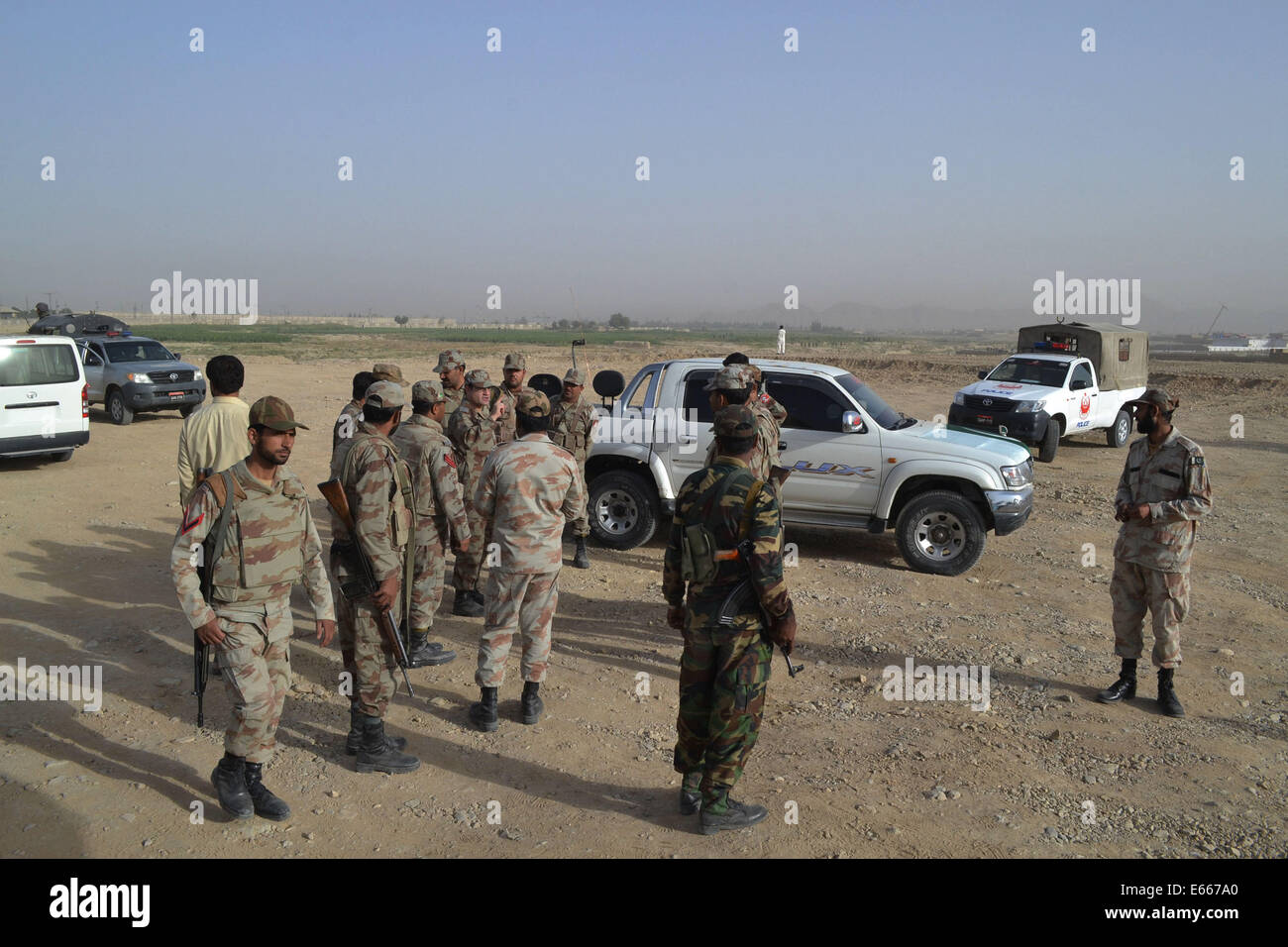 Quetta. 15th Aug, 2014. Pakistani security personnel gather near ...
