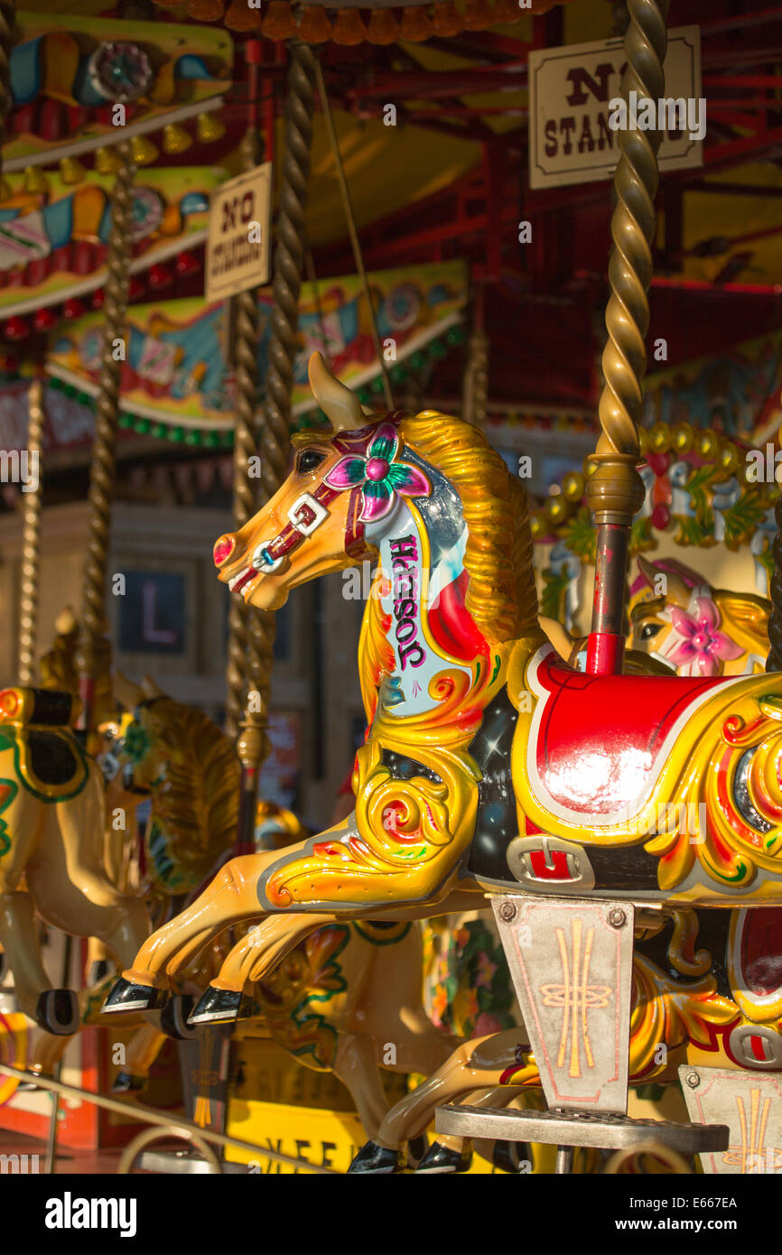 Children on a roundabout at a fun fair hi-res stock photography and ...