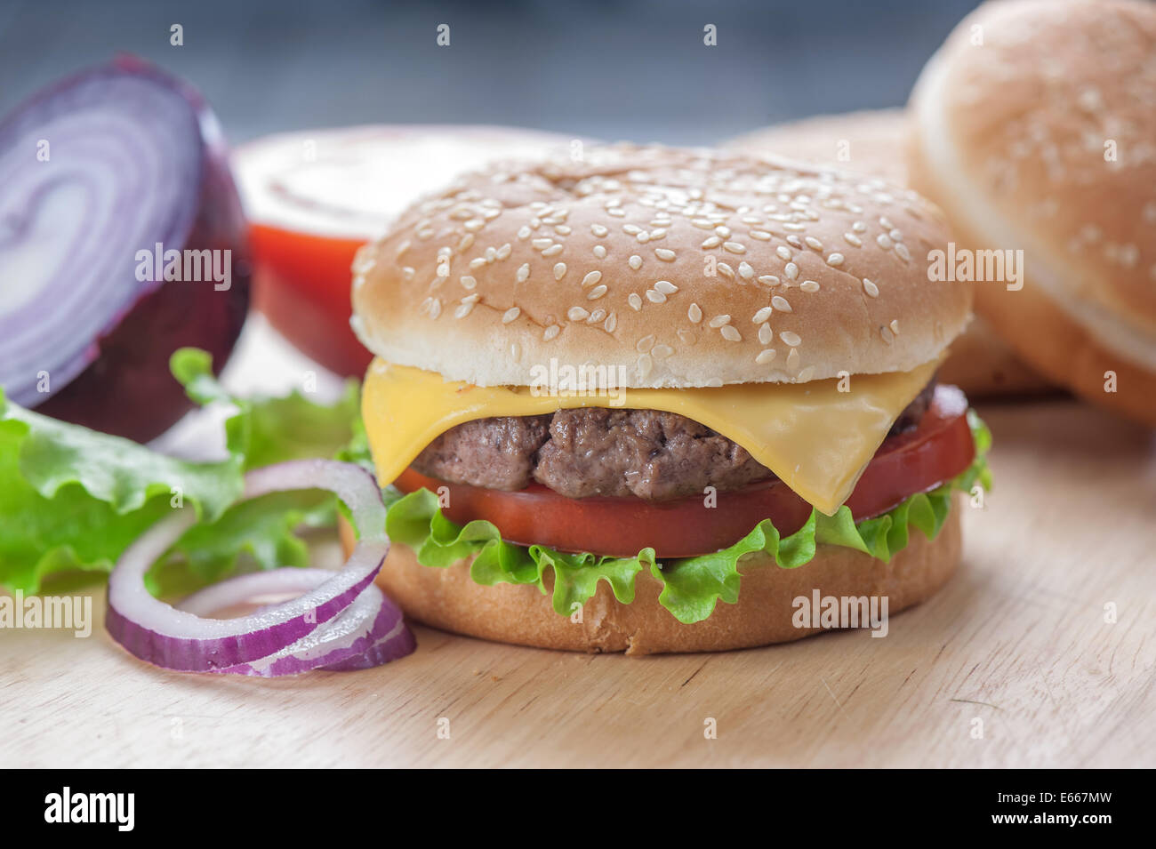 appetizing cheeseburger with red onion closeup Stock Photo - Alamy