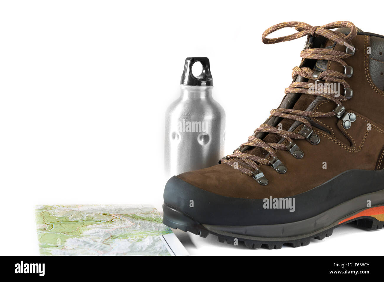 hiking boot with a water bottle and a topographic map Stock Photo - Alamy