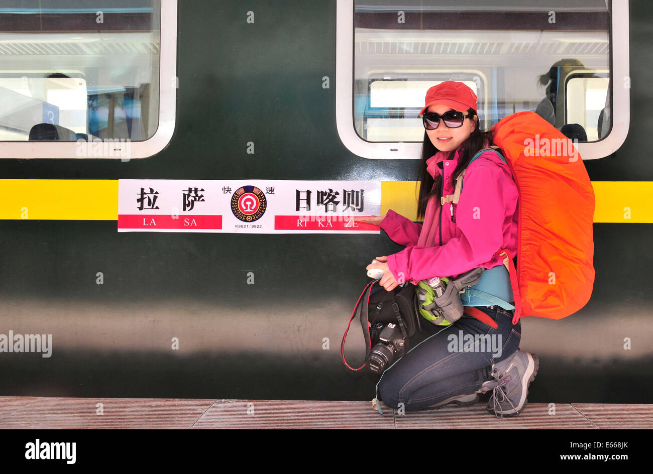 Xigaze, China's Tibet Autonomous Region. 16th Aug, 2014. A passenger ...