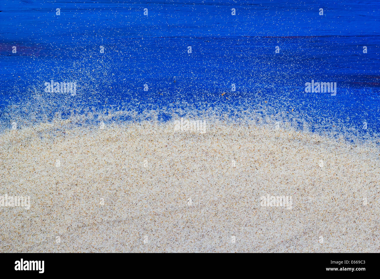 Marine background with sand spilled on a wooden table Stock Photo - Alamy