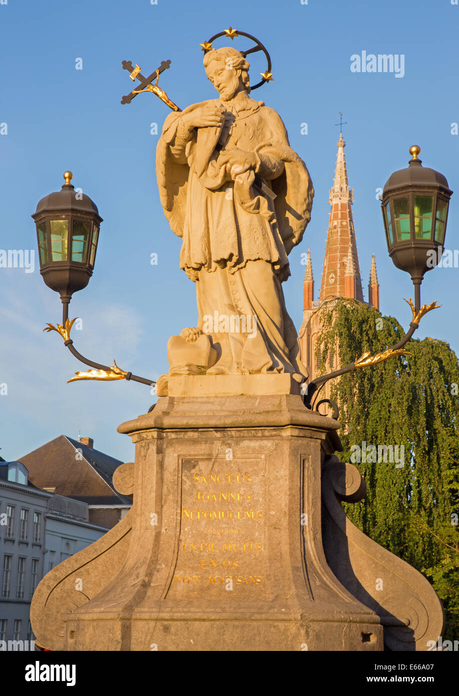 Bruges - The st. John the Nepomuk statue on the bridge and the tower of ...
