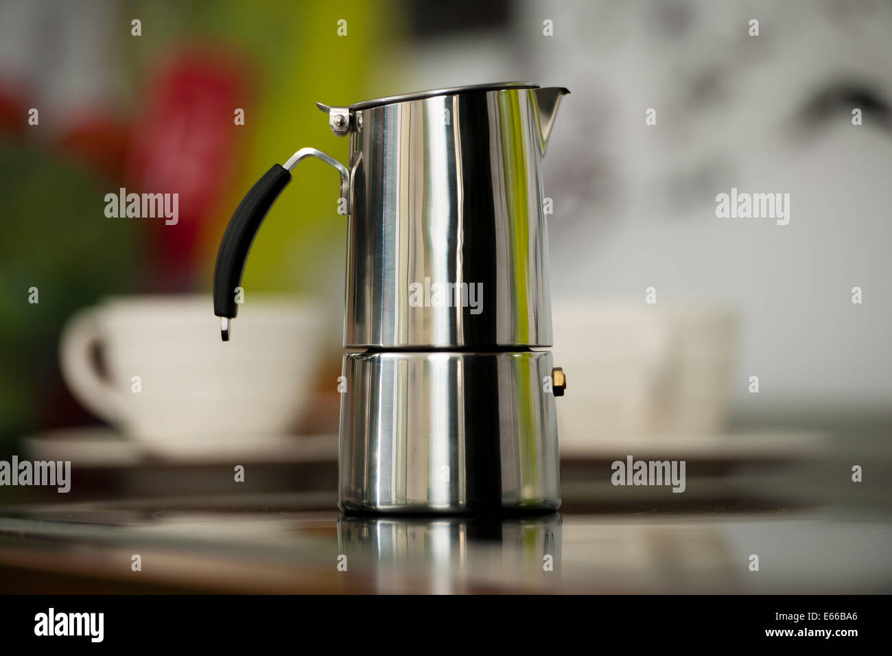 cooking espresso coffee with italian cafetera at home in the morning ...