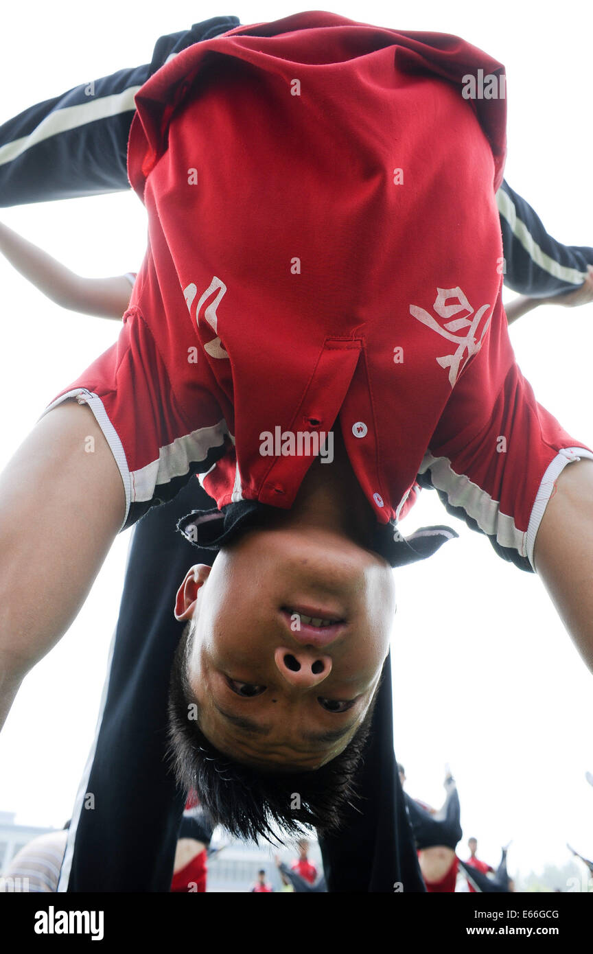 Nanjing, China. 15th Aug, 2014. Young performers from Songshan Shaolin ...