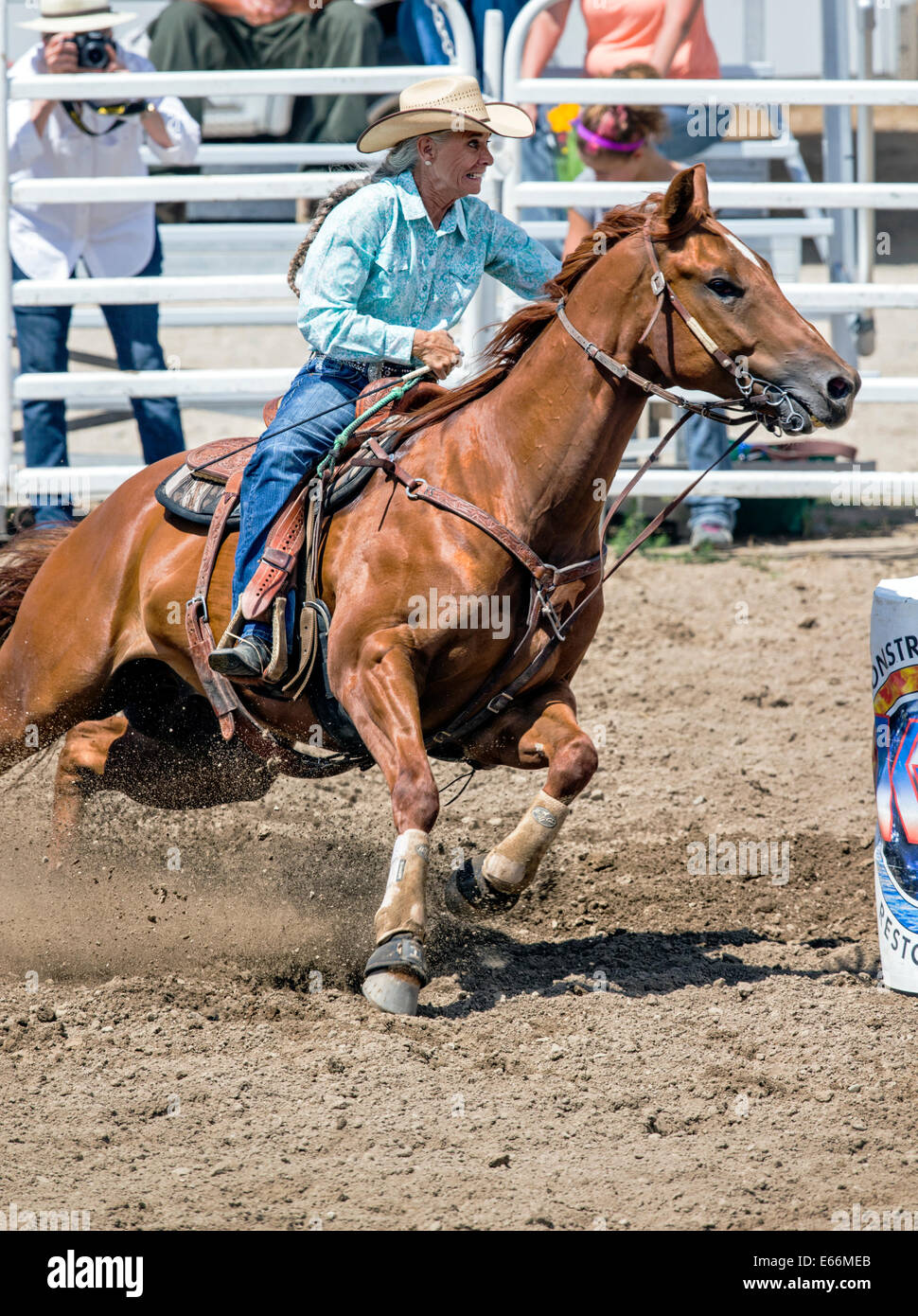 Cowgirl on horseback riding in the ladies barrel racing event, Chaffee ...