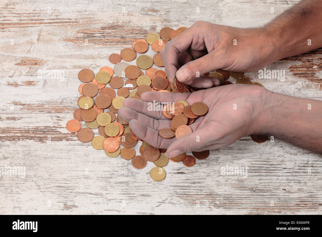 a poor hands taking some coins Stock Photo - Alamy
