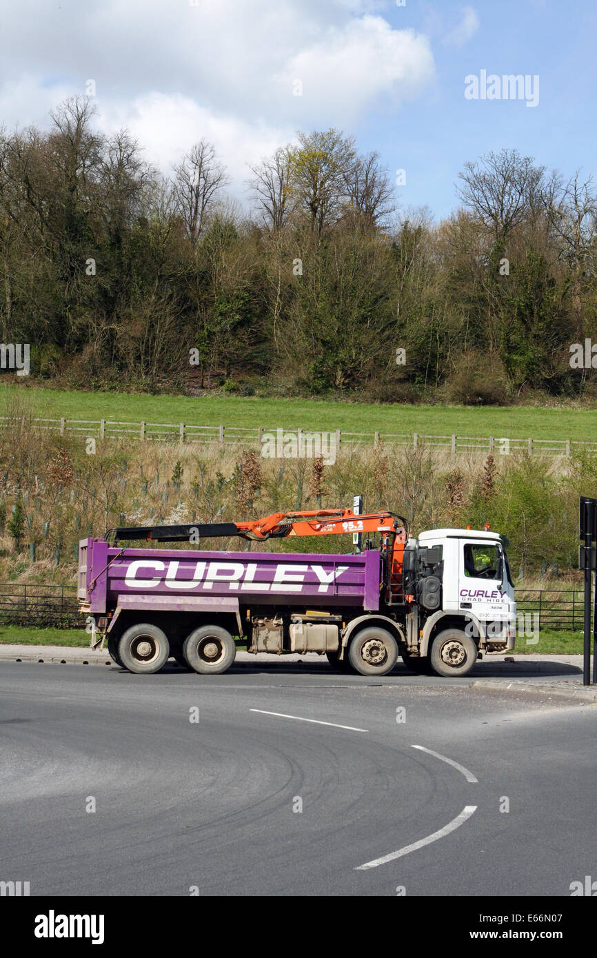 A truck traveling around a roundabout in Coulsdon, Surrey, England ...
