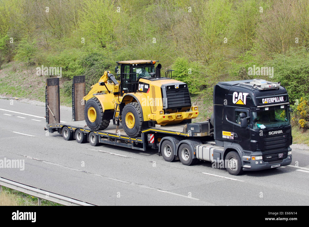 A low loader hauling heavy plant along the M20 motorway in Kent ...