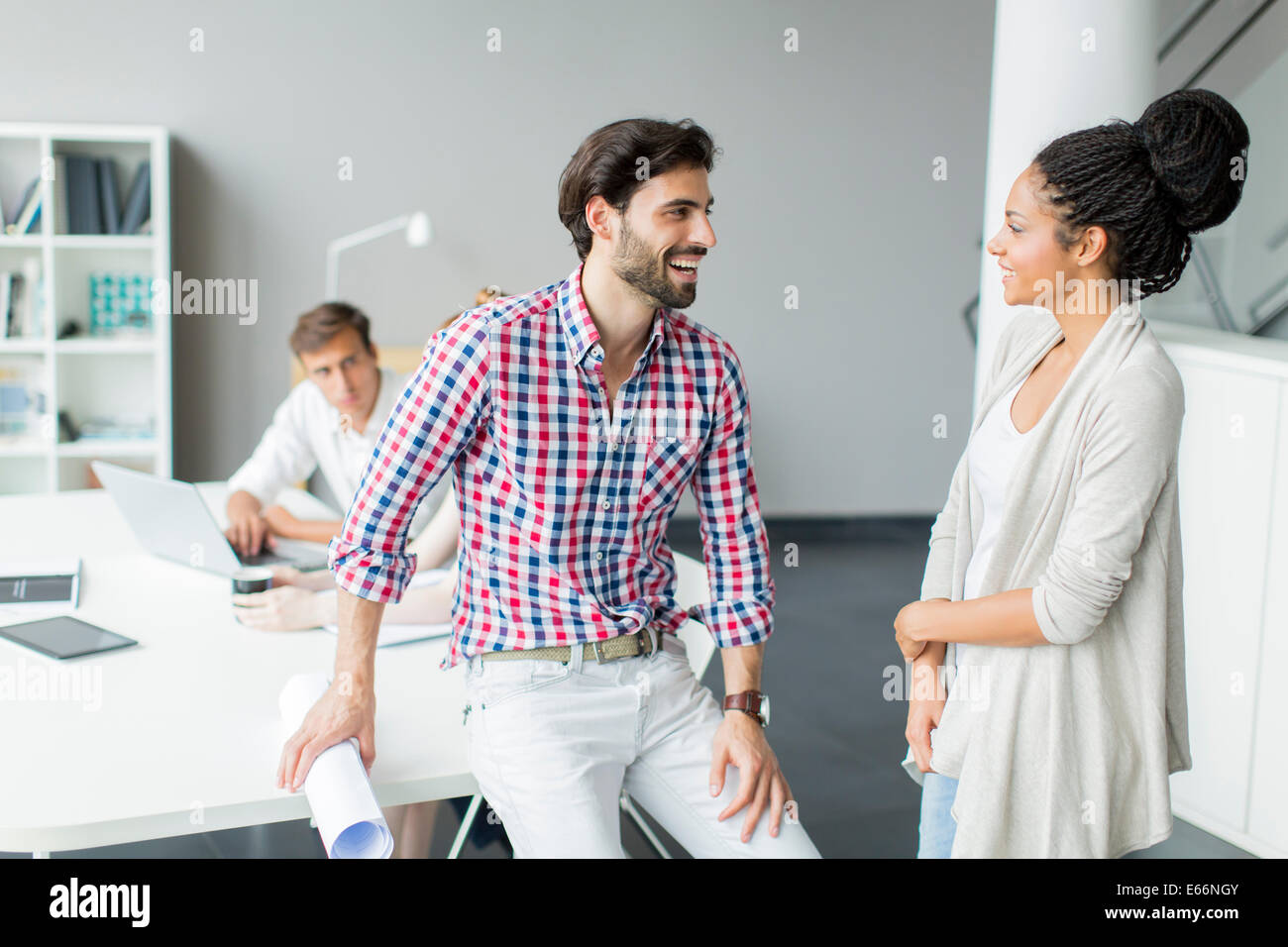 Young people in the office Stock Photo - Alamy