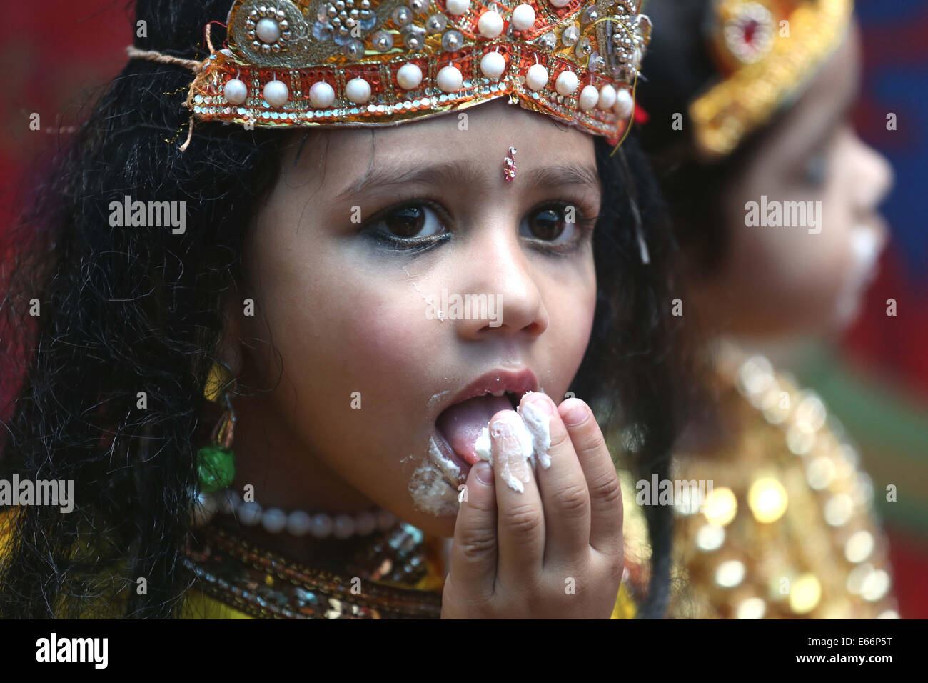 Bhopal. 16th Aug, 2014. A girl dresses as Lord Krishna before the ...