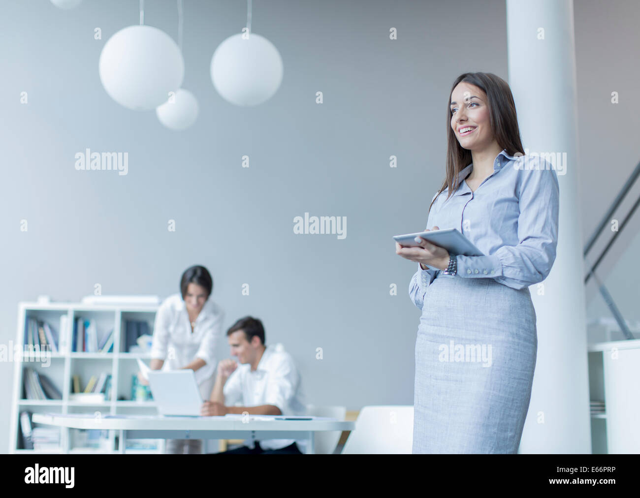 Young people in the office Stock Photo - Alamy