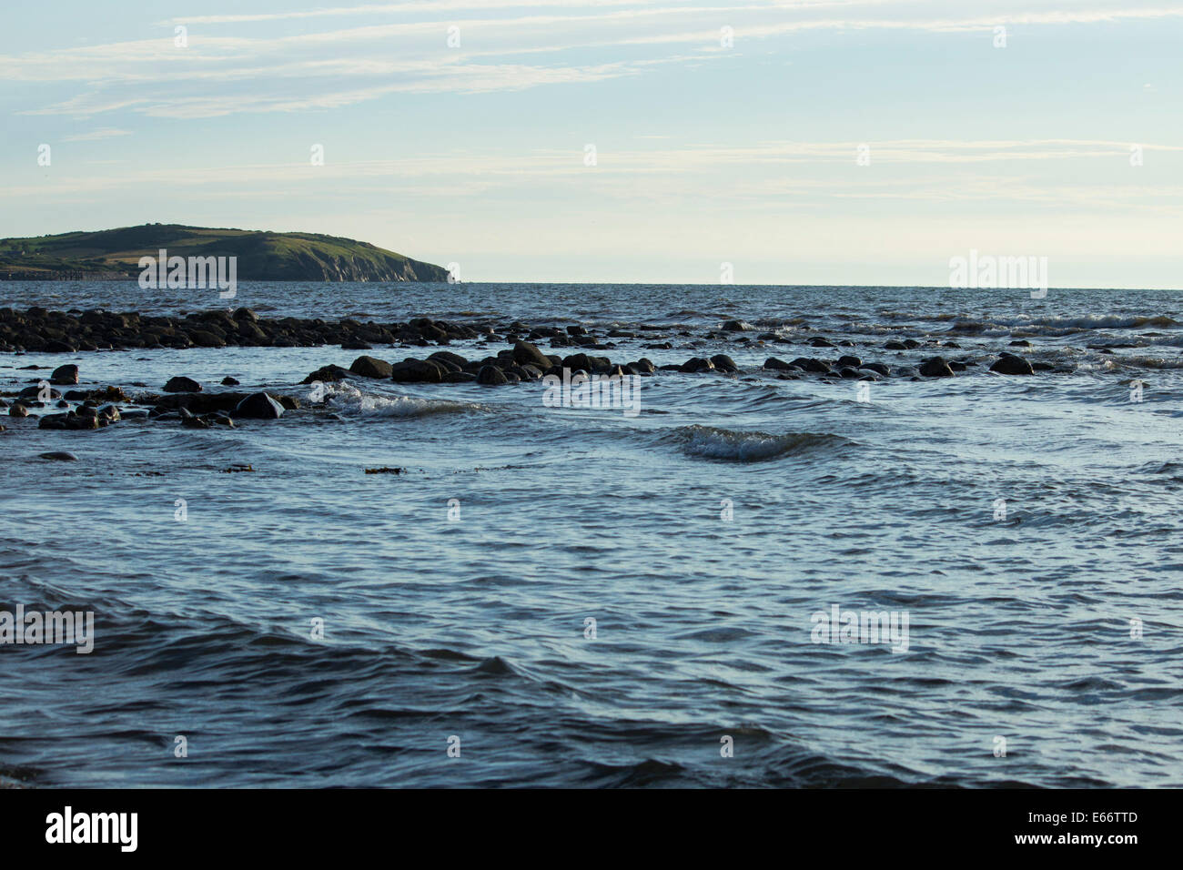 Tide coming in on the Welsh coastline Stock Photo - Alamy