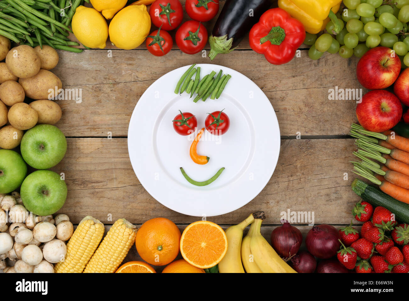Healthy eating smiling face from vegetables and fruits on plate Stock ...