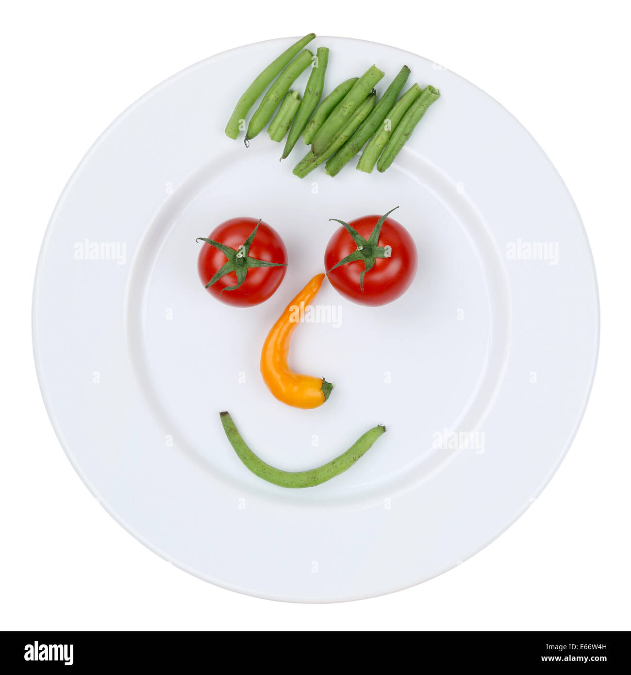 Healthy eating smiling face from vegetables on plate, isolated on a ...