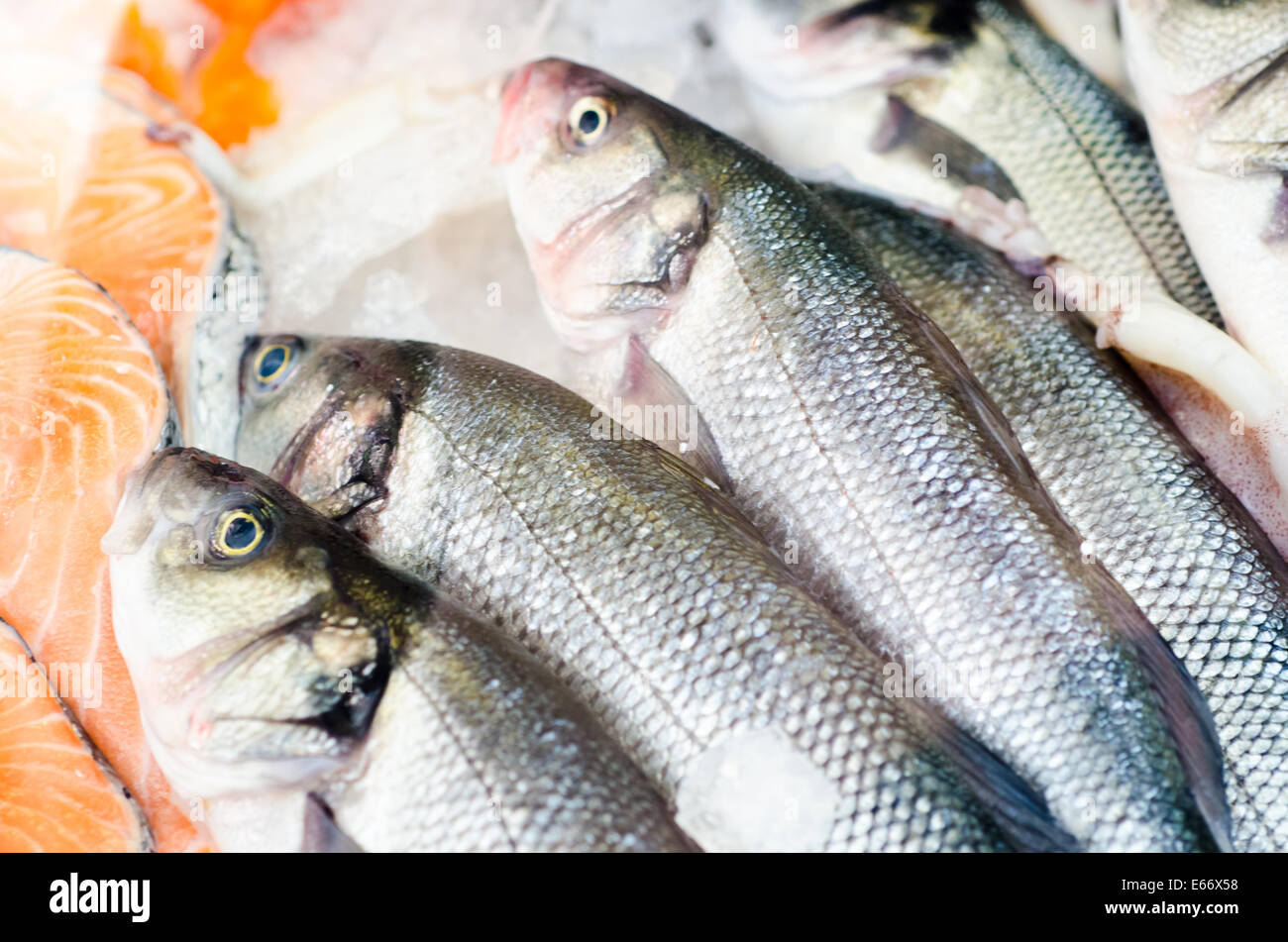raw fish fillet on ice of market desk Stock Photo - Alamy