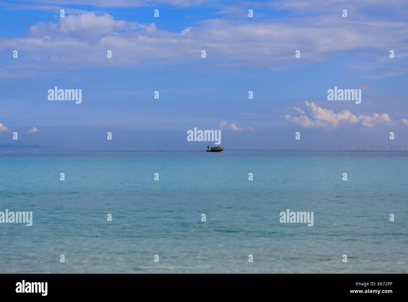 Blue sea and sky with heavy clouds Stock Photo - Alamy