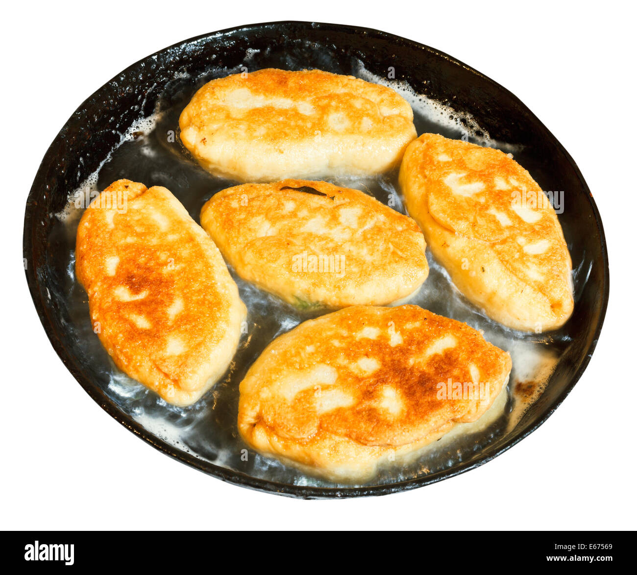 Onion fried in pan Cut Out Stock Images & Pictures - Alamy