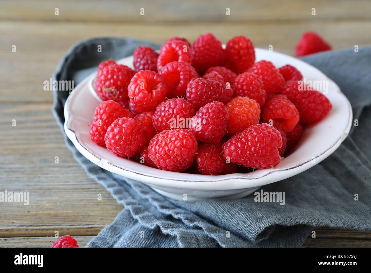 full bowl of fragrant raspberries, food closeup Stock Photo - Alamy
