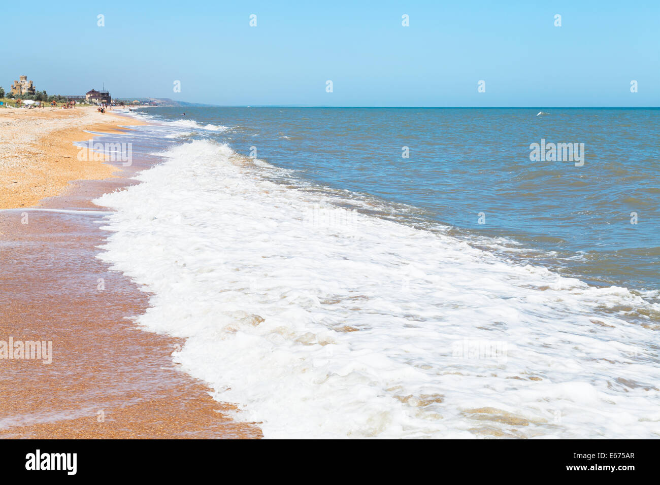 sand and seashells beach of Sea of Azov in resort settlement ...