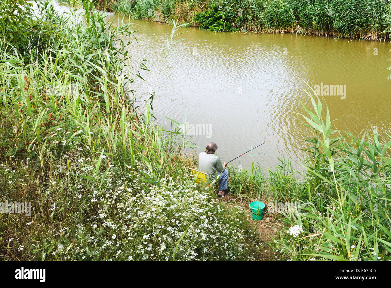 Waterfront scene line fishing hi-res stock photography and images - Alamy