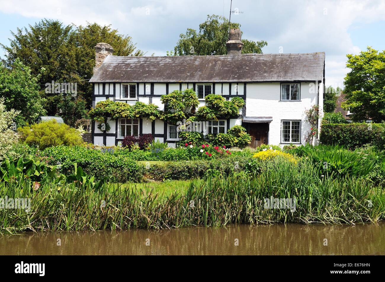 River Arrow with a pretty black and white timbered cottage to the rear ...