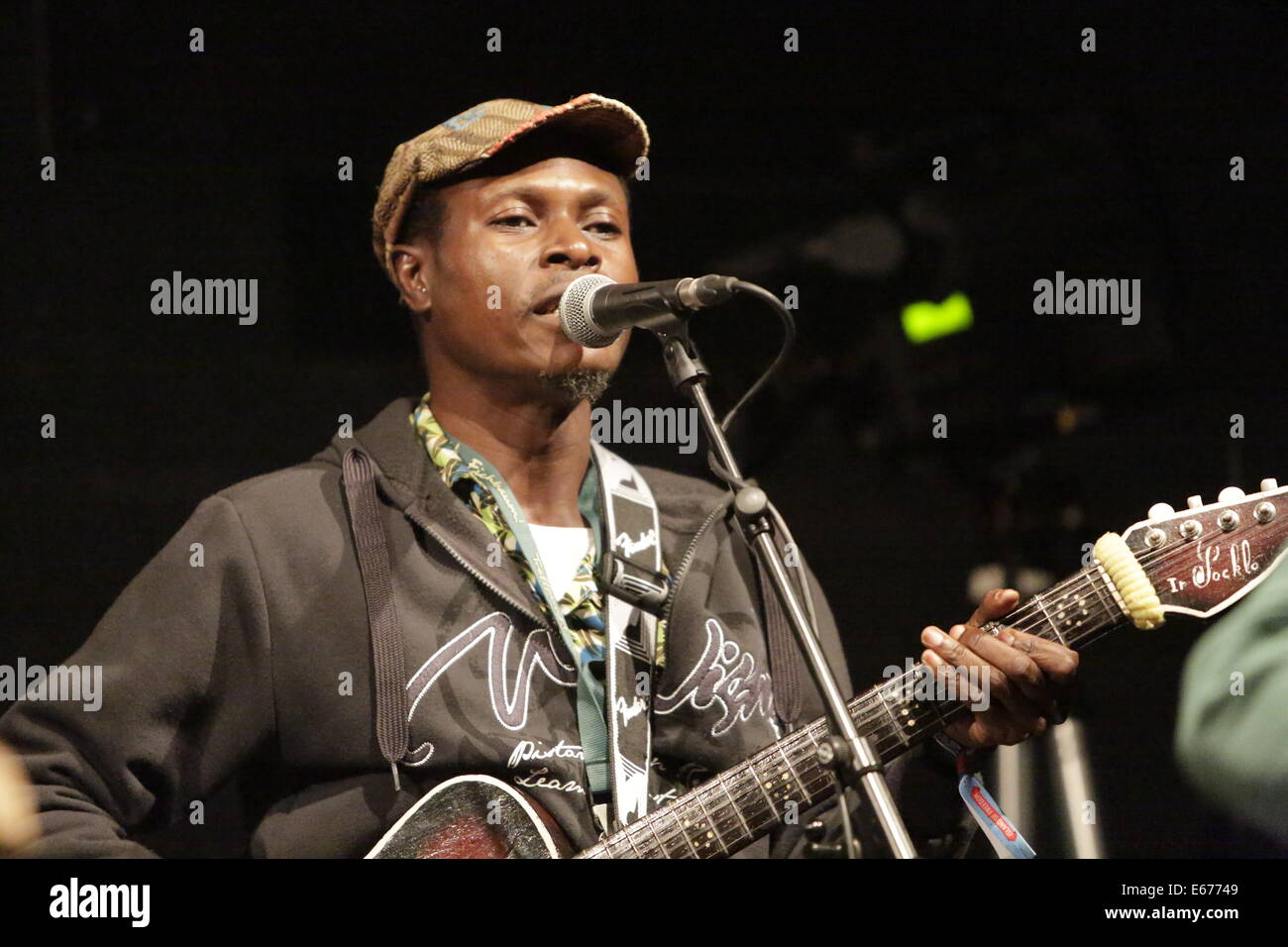 Worms, Germany. 16th August 2014. A guitarist of Jupiter & Okwess ...