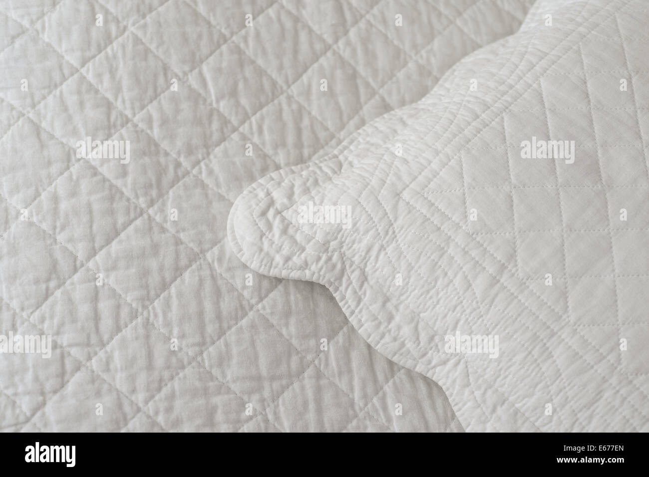Quilted white natural textiles Stock Photo - Alamy