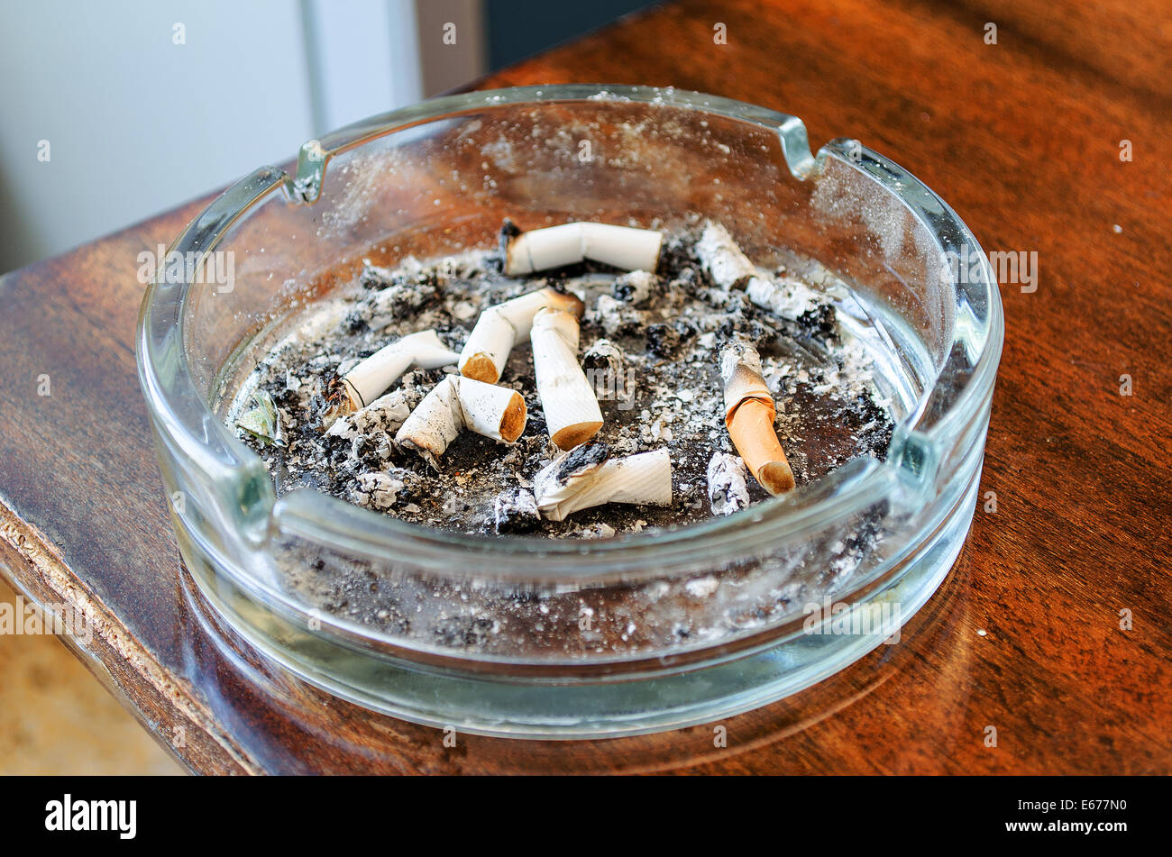 Ashtray Full of Cigarettes burnt butts wet and disgusting Stock Photo ...