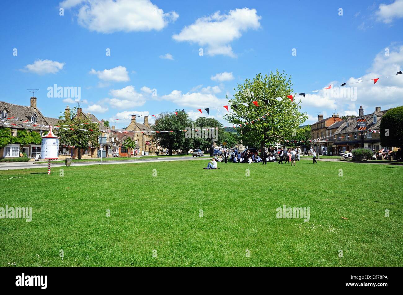 View of the village green and High Street in the centre of the village ...