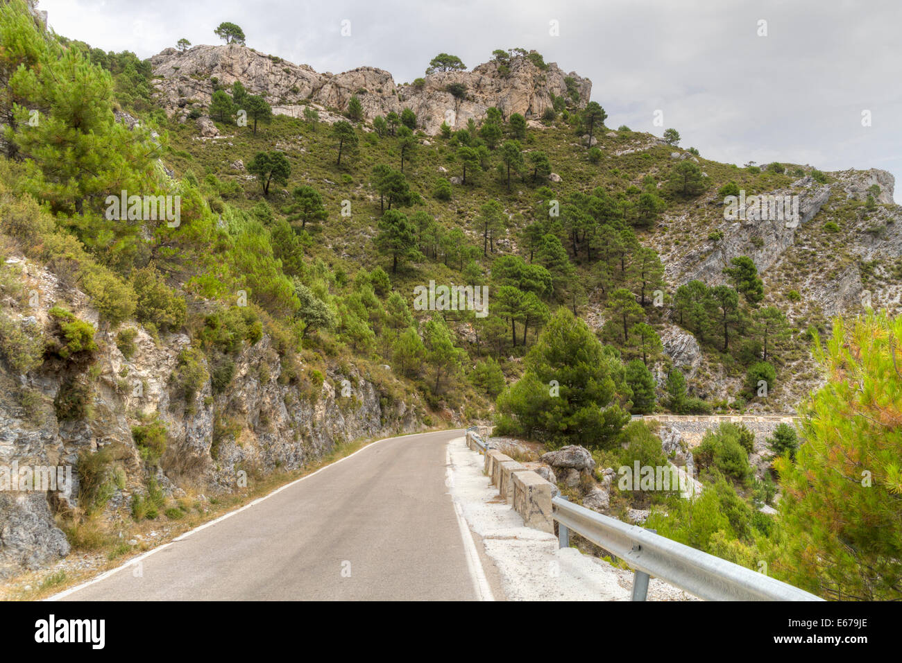 Narrow mountain road running through the Sierra del Chaparral National ...